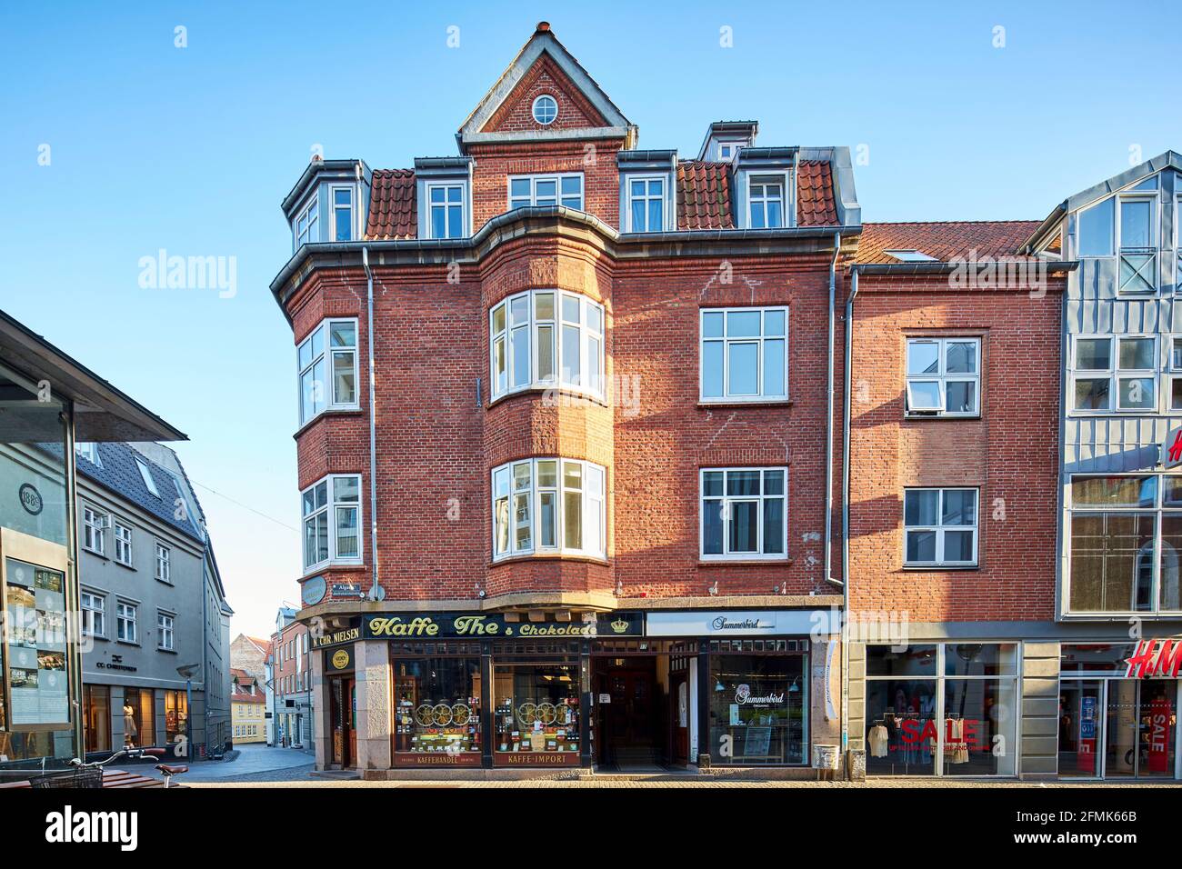 red brick apartment building in corner in denmark Stock Photo - Alamy