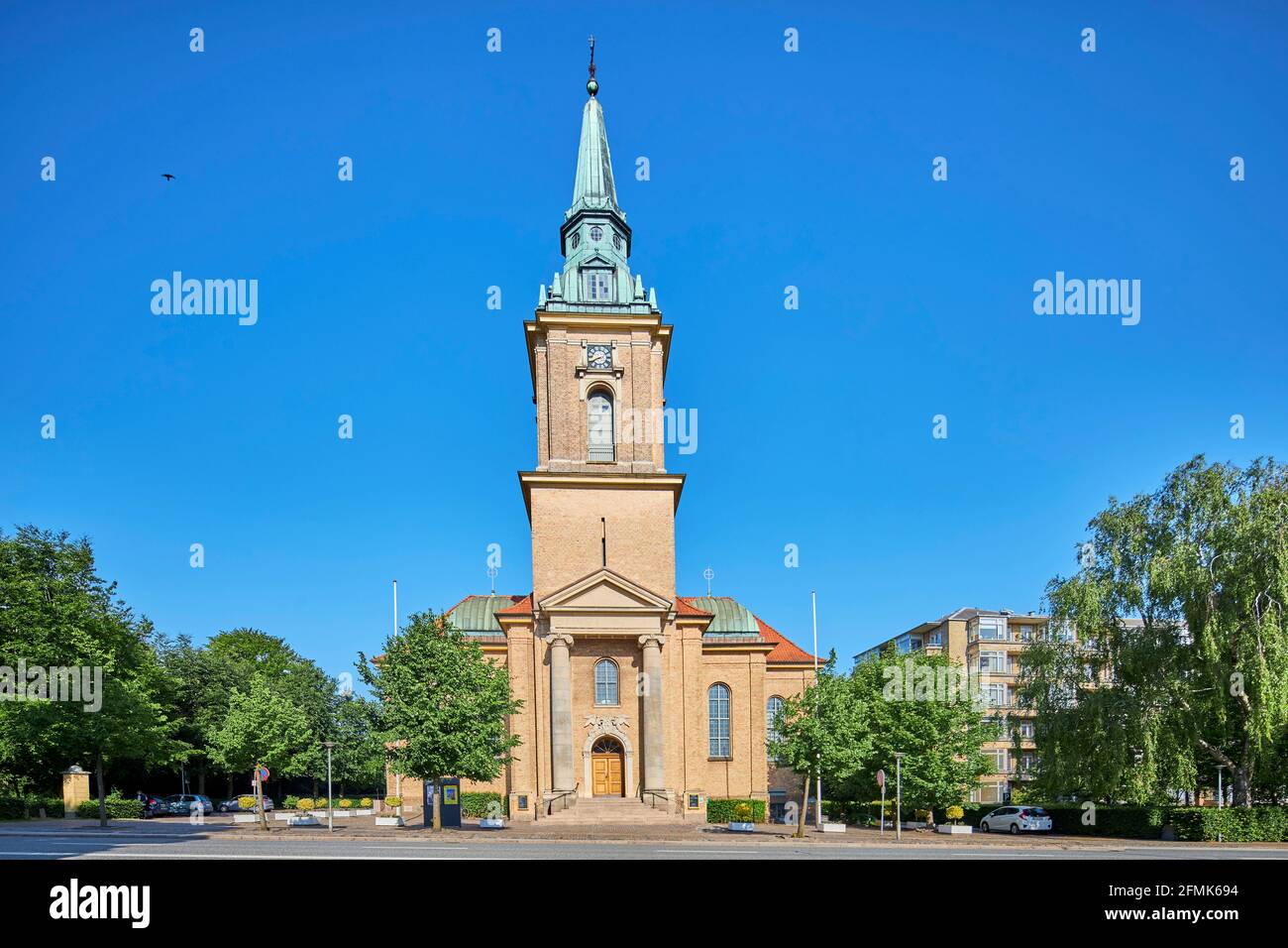 large tall church building in denmark with blue sky Stock Photo - Alamy