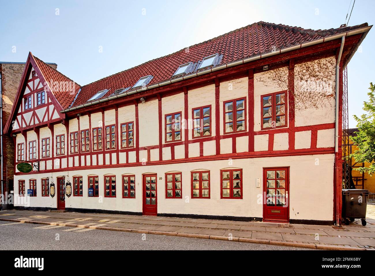 a beautiful red strip building in scandinavian city Stock Photo - Alamy
