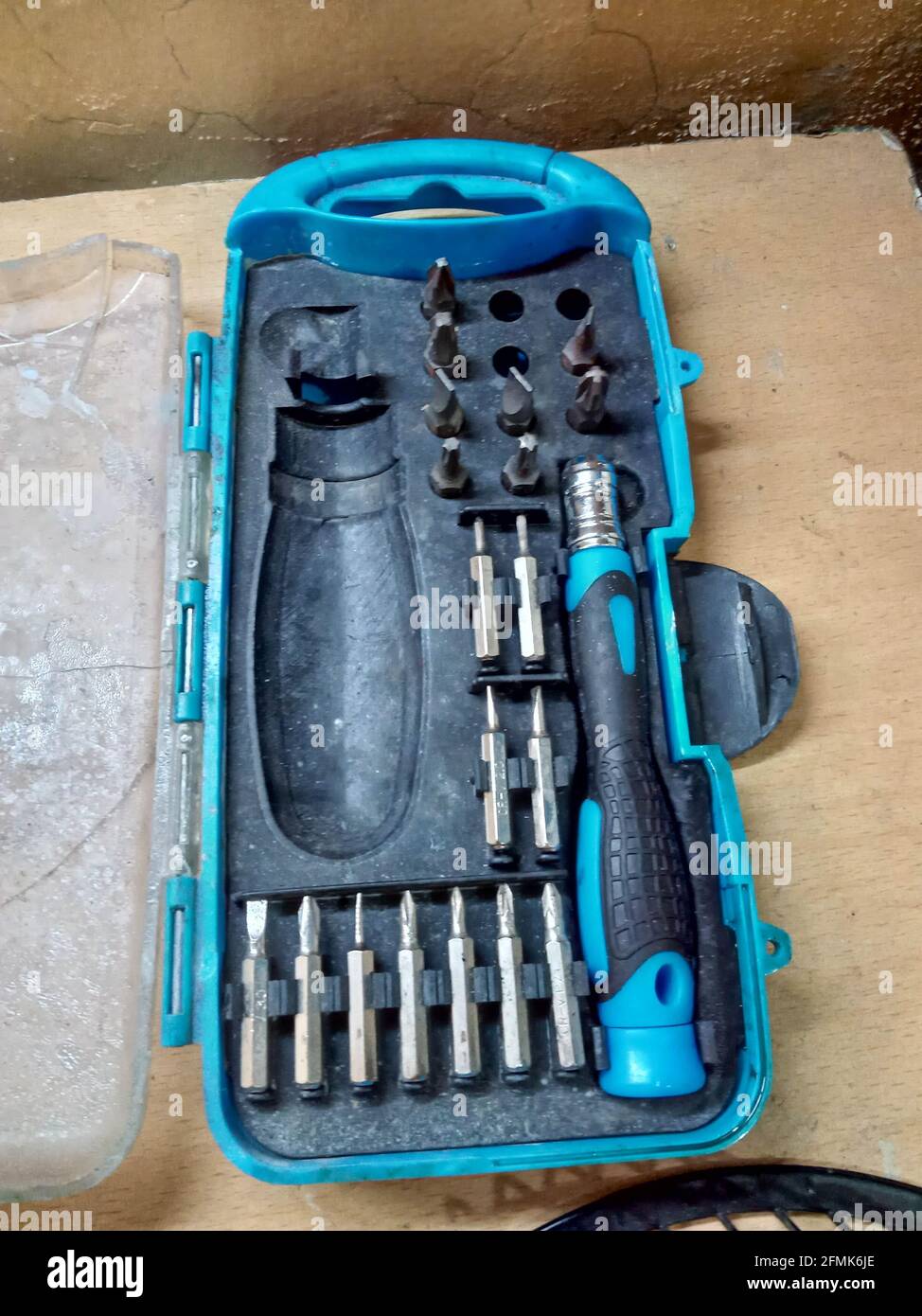 a color photo of a screwdriver set is blue on the table Stock Photo - Alamy
