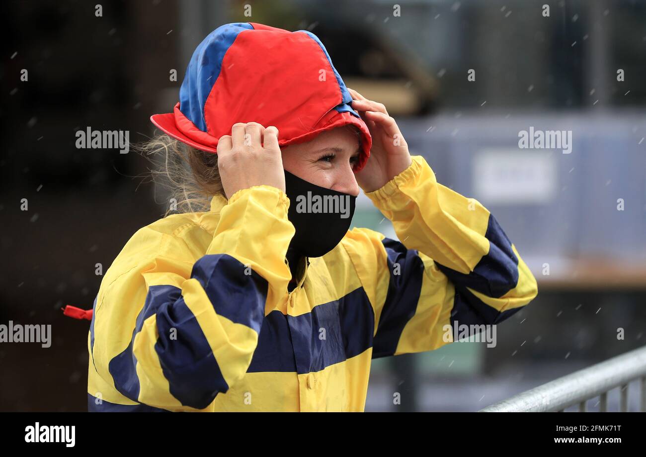 Joanna Mason shields from the rain before the Racing Supporting Mental ...