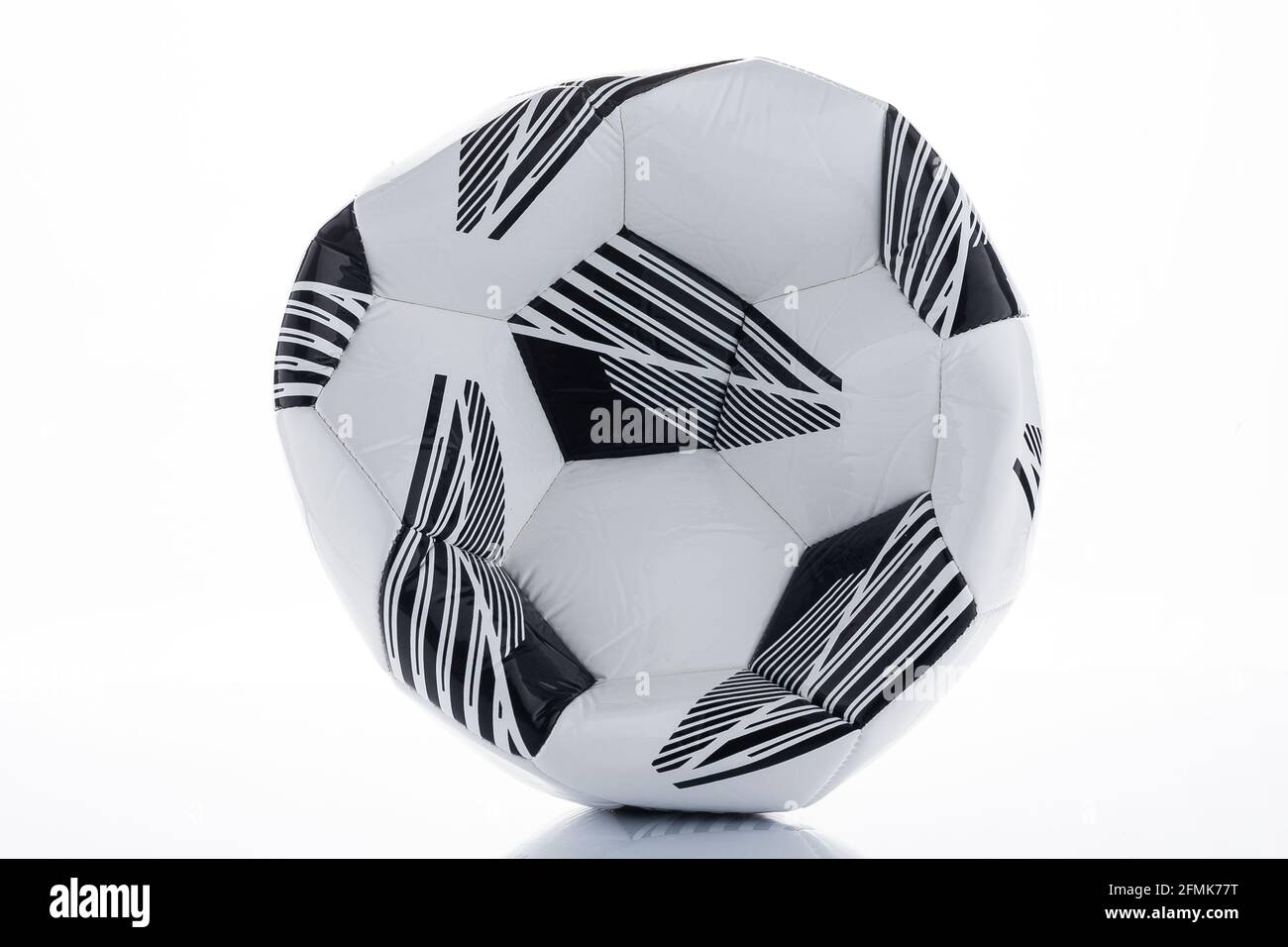 Deflated soccer, football ball on a white background Stock Photo - Alamy