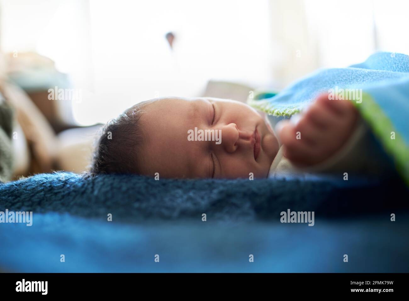 Sweet baby sleeping on a cozy bed Stock Photo - Alamy