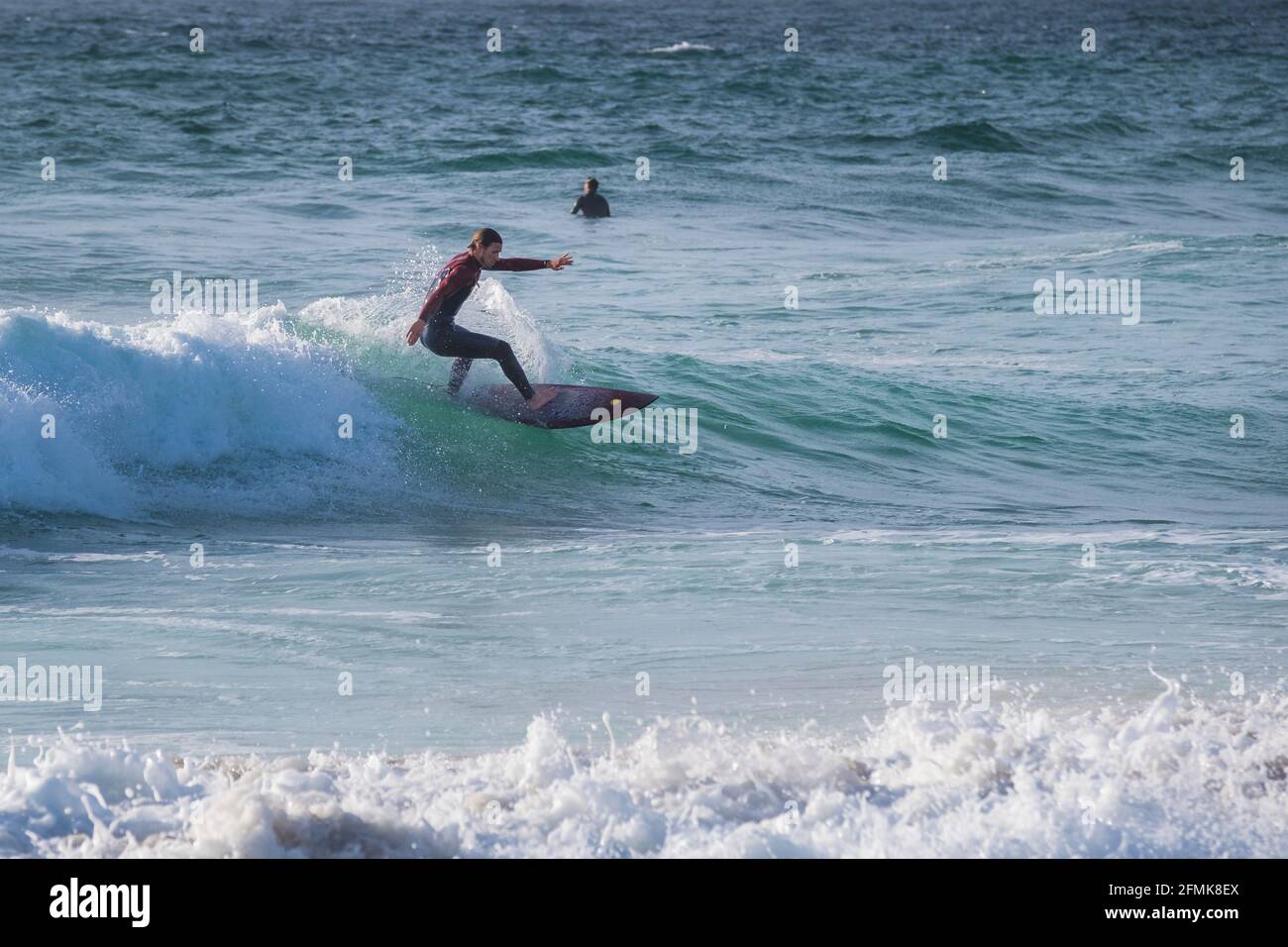 A surfer riding a wave at Fistral in Newquay in Cornwall Stock Photo ...