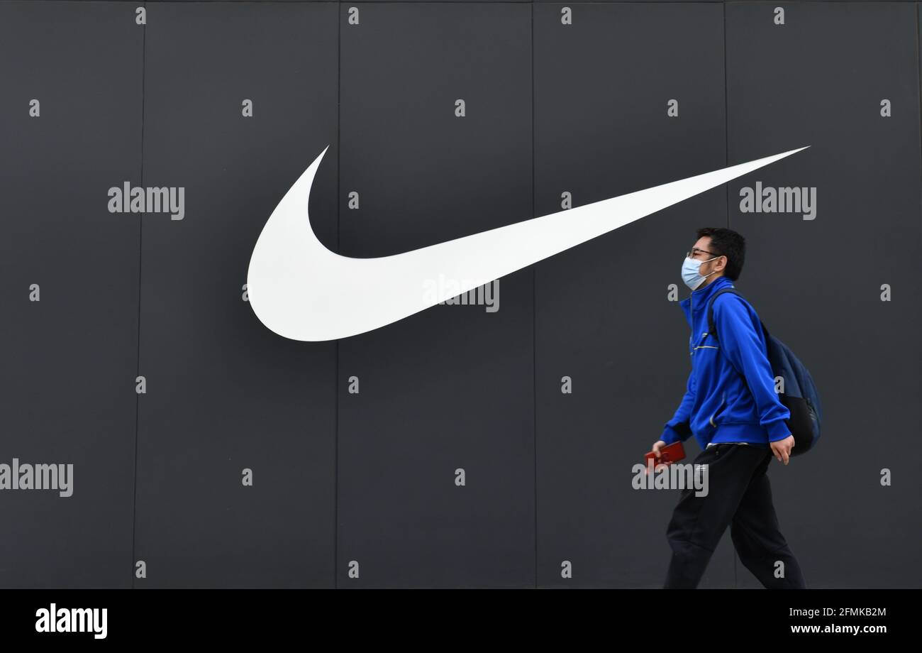 BEIJING, CHINA - MAY 10, 2021 - A pedestrian passes in front of the ...