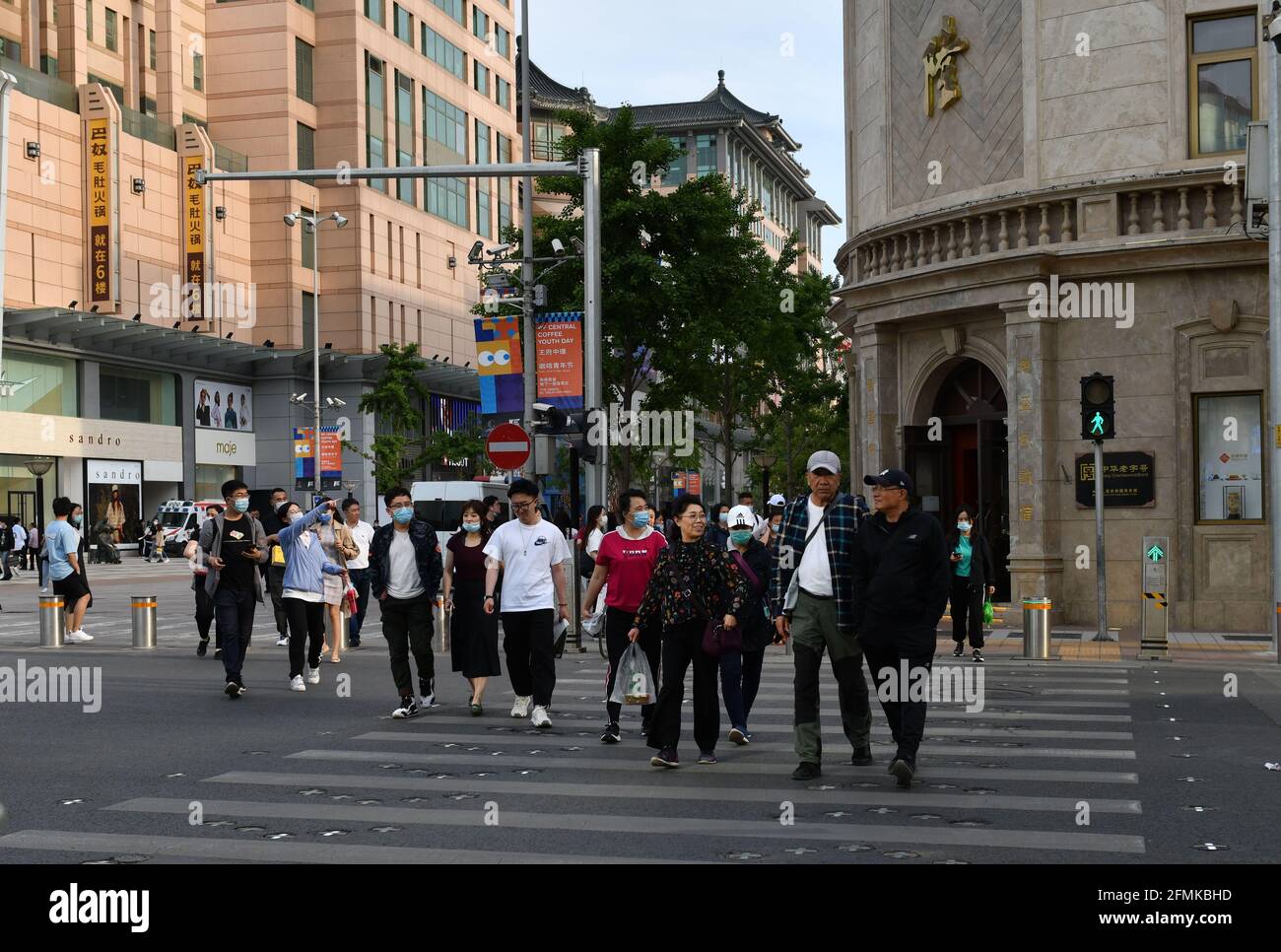 BEIJING, CHINA - MAY 10, 2021 - People visit the Wangfujing pedestrian ...