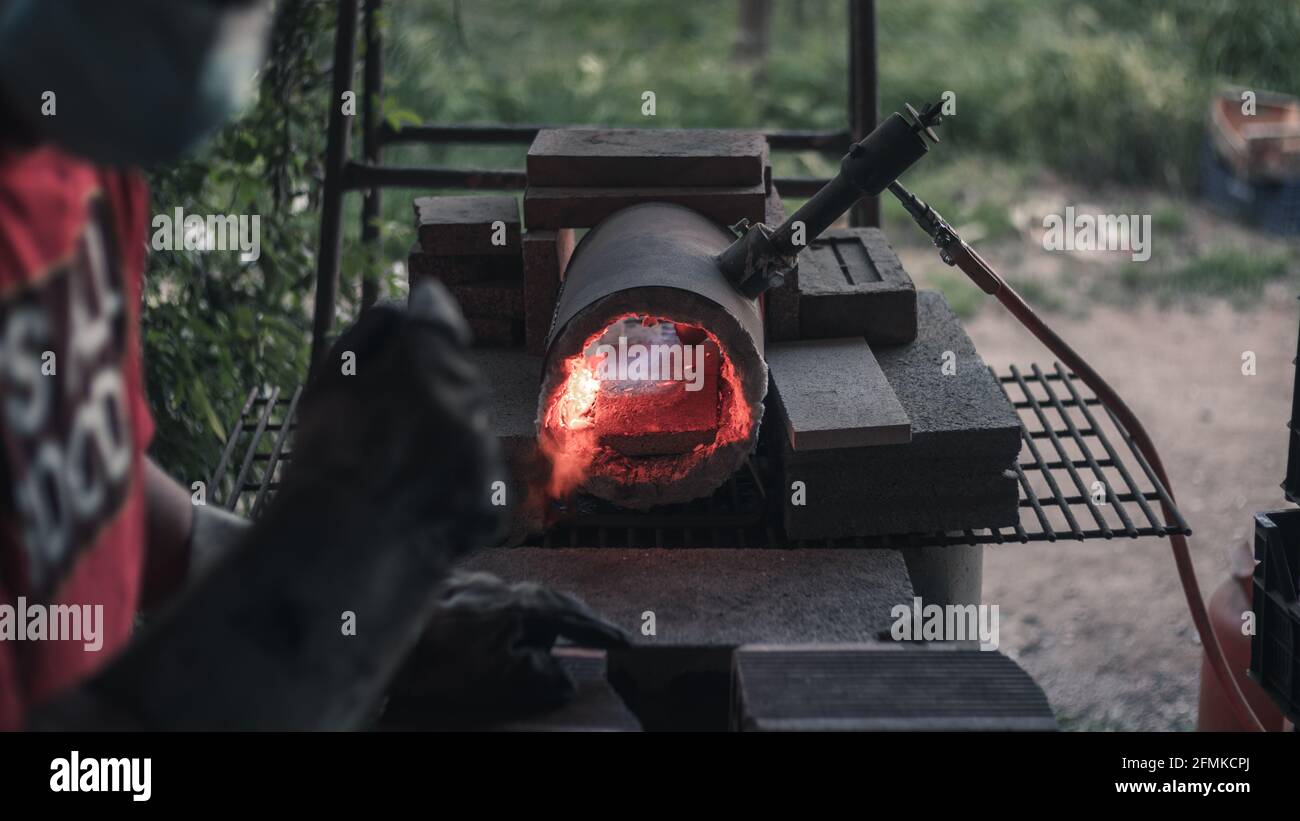 Heating steel in a gas forge Stock Photo - Alamy