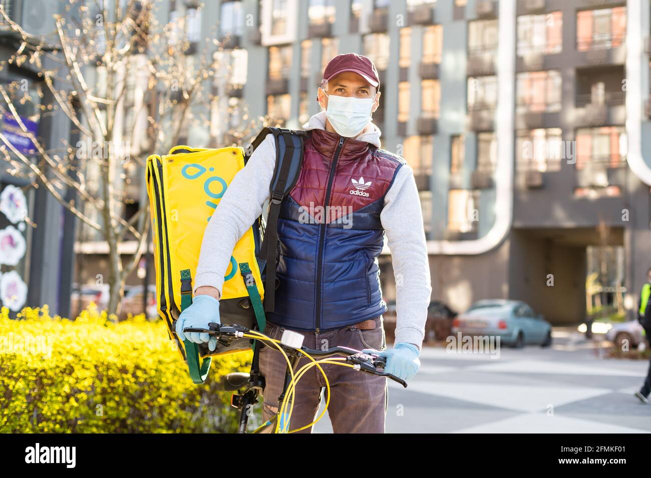 KIEV, UKRAINE - April 28, 2021: Glovo bike courier on the street ...