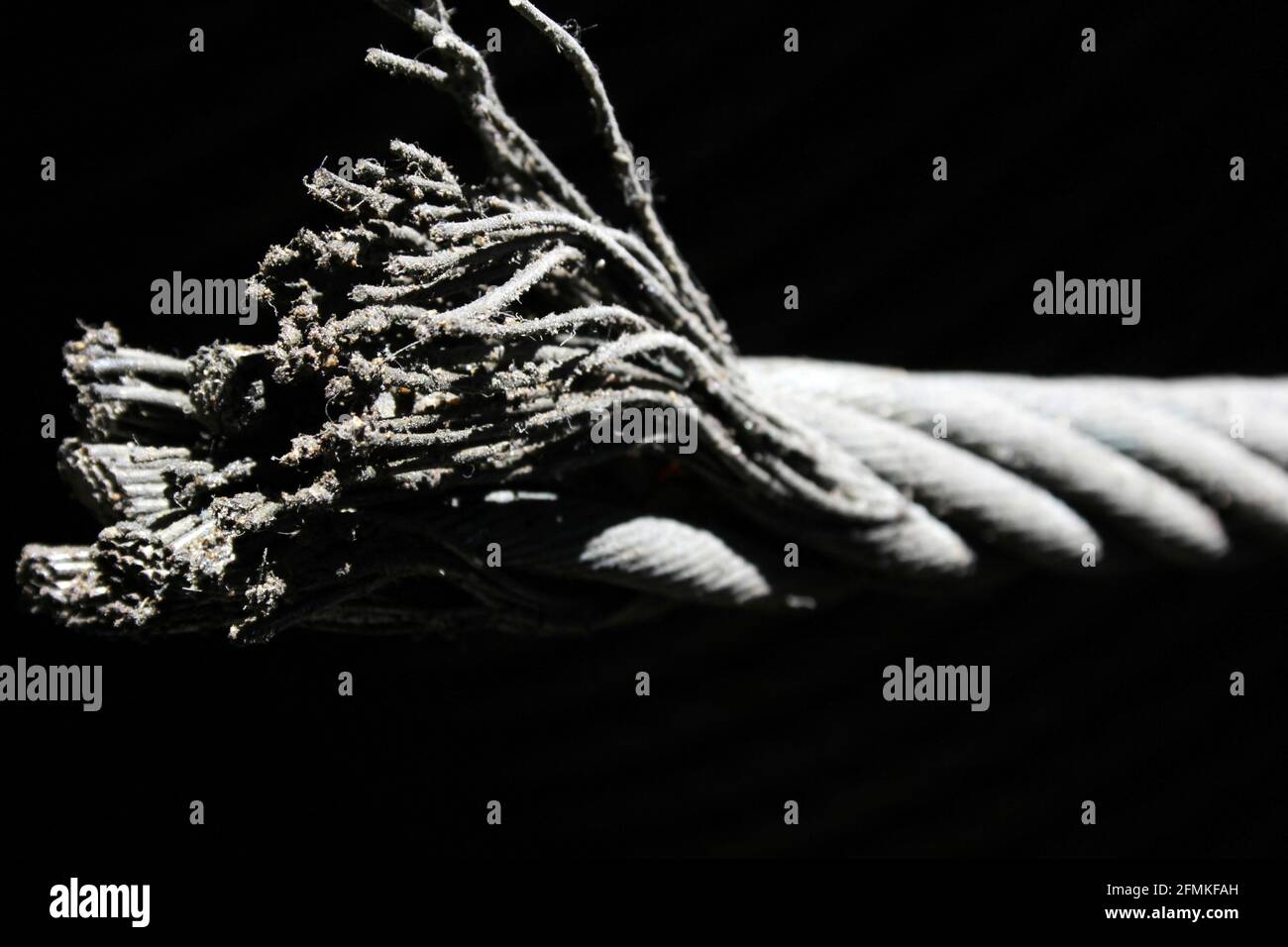 steel rope on black background Stock Photo - Alamy