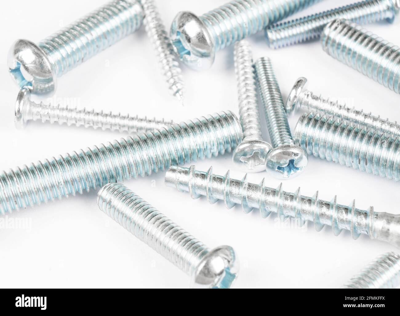 Metal bolts a row background. Chromed screw bolts isolated. Steel bolts ...