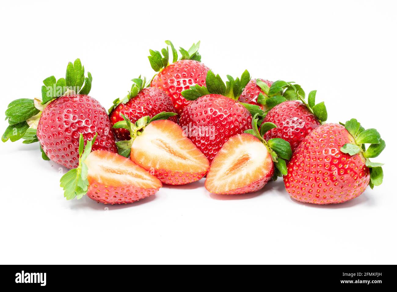 Large group of fresh retouched perfect strawberries whole and cut on ...