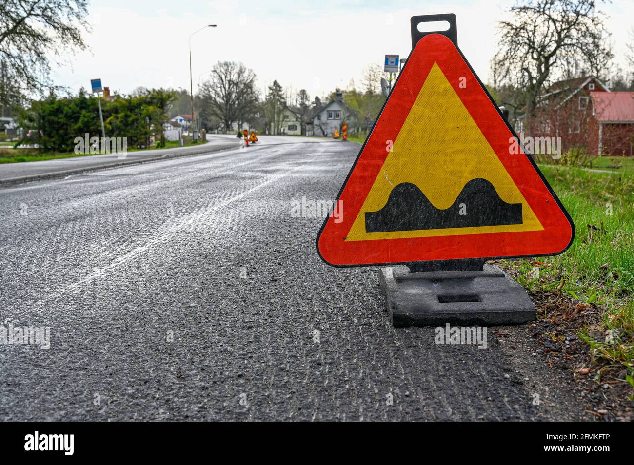 road sign with warning of bumpy road Stock Photo - Alamy