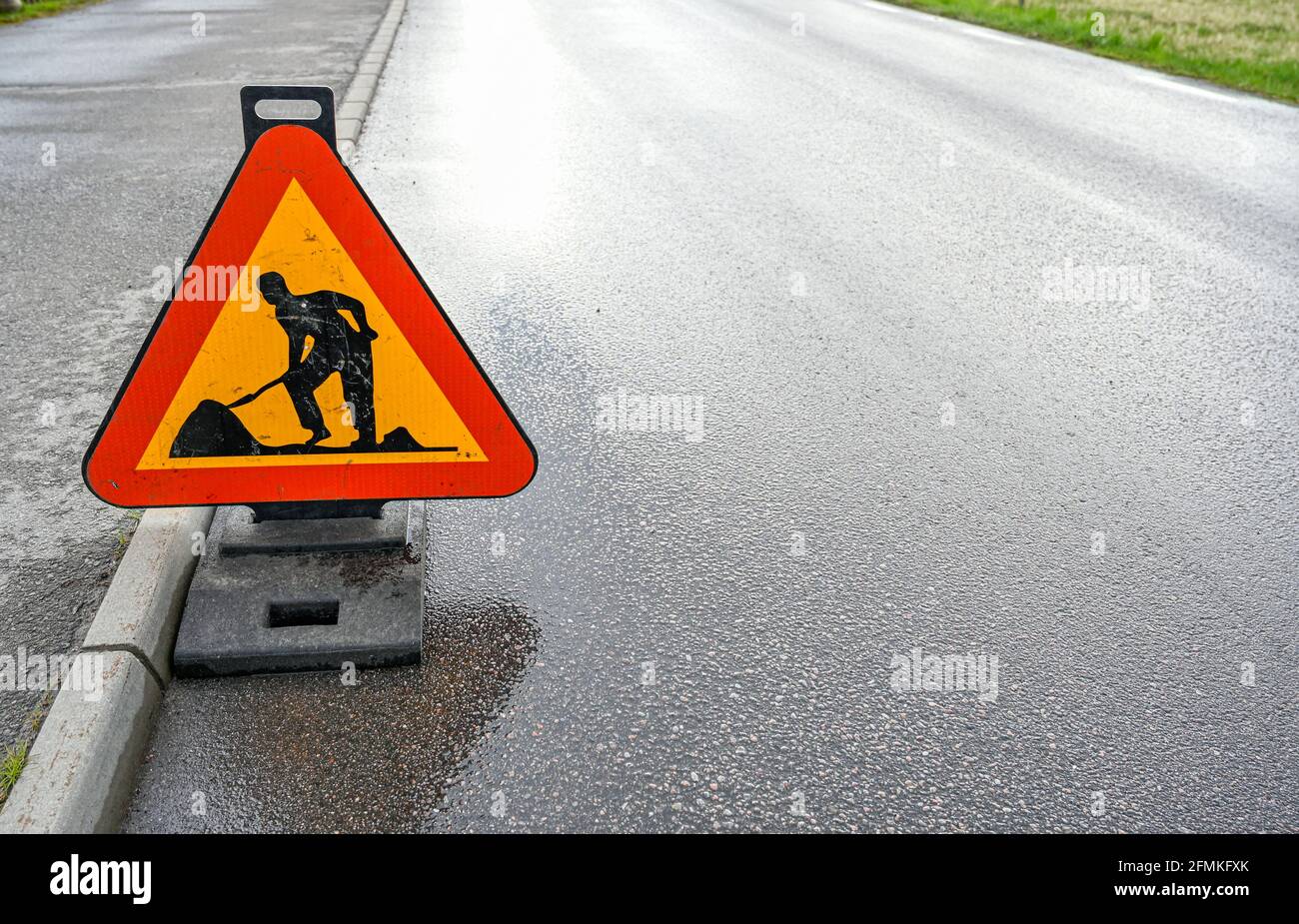 road sign with warning of road work Stock Photo - Alamy