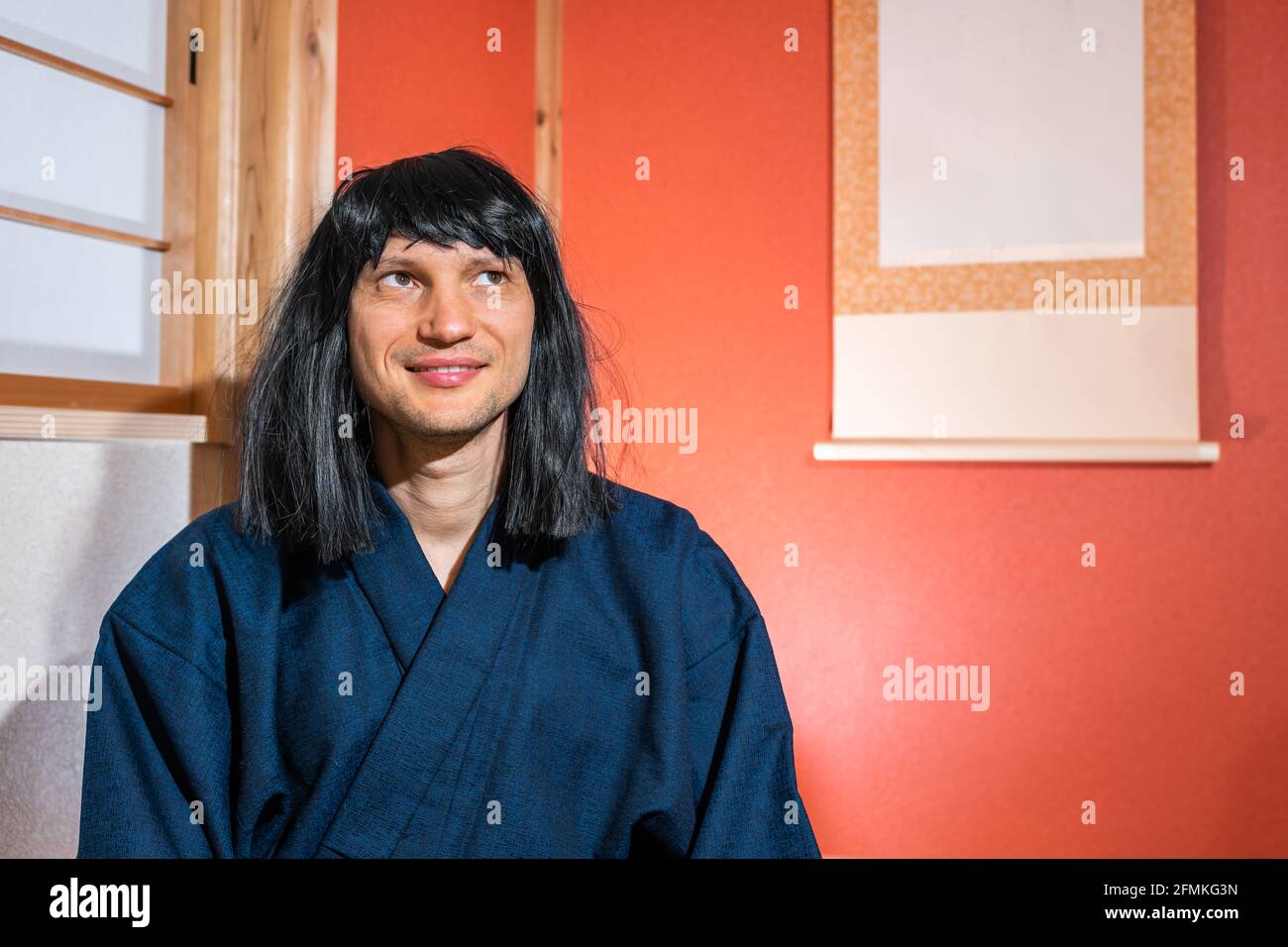 Traditional sliding paper shoji doors in Japan with man in kimono ...