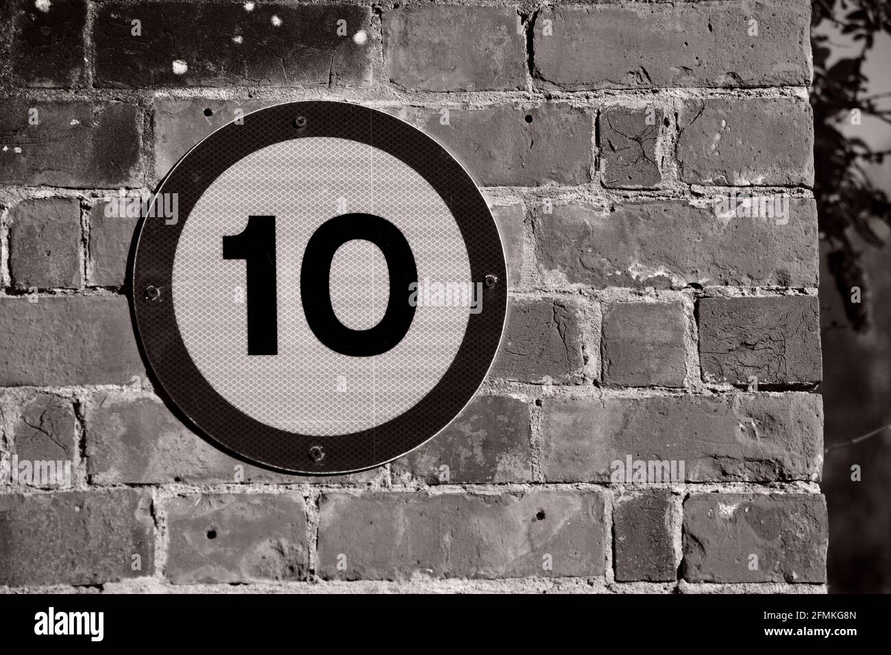 10 miles an hour traffic sign on an old brick background Stock Photo ...