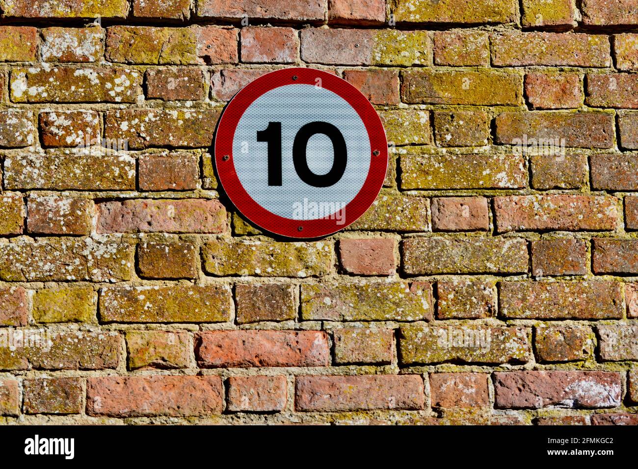 10 miles an hour traffic sign on an old brick background Stock Photo ...