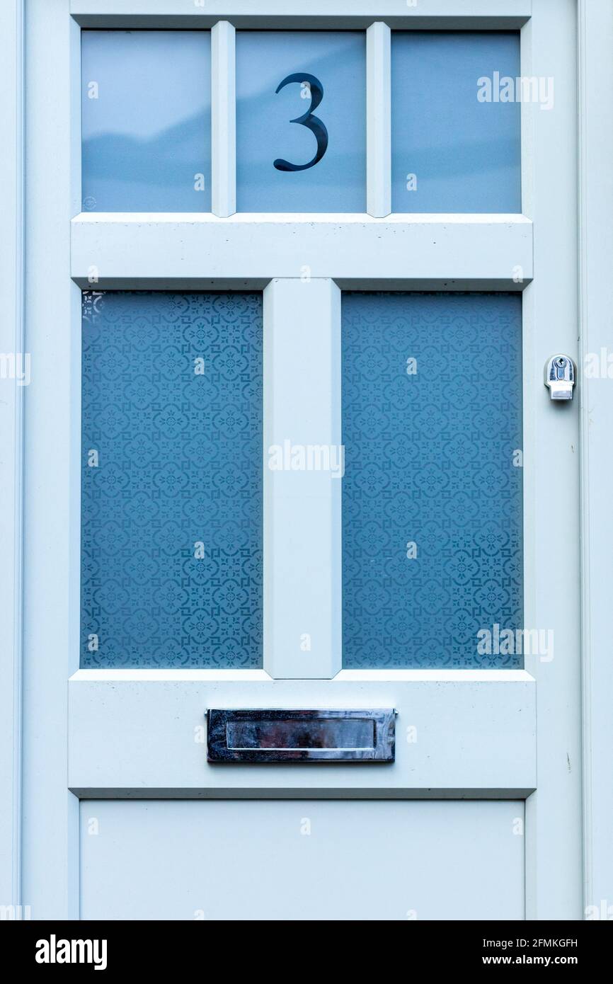 House door number 3 in white with letterbox Stock Photo - Alamy