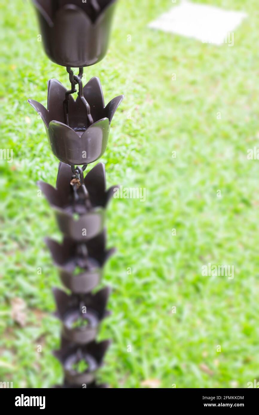 Rain gutter bell in home grass field, stock photo Stock Photo - Alamy