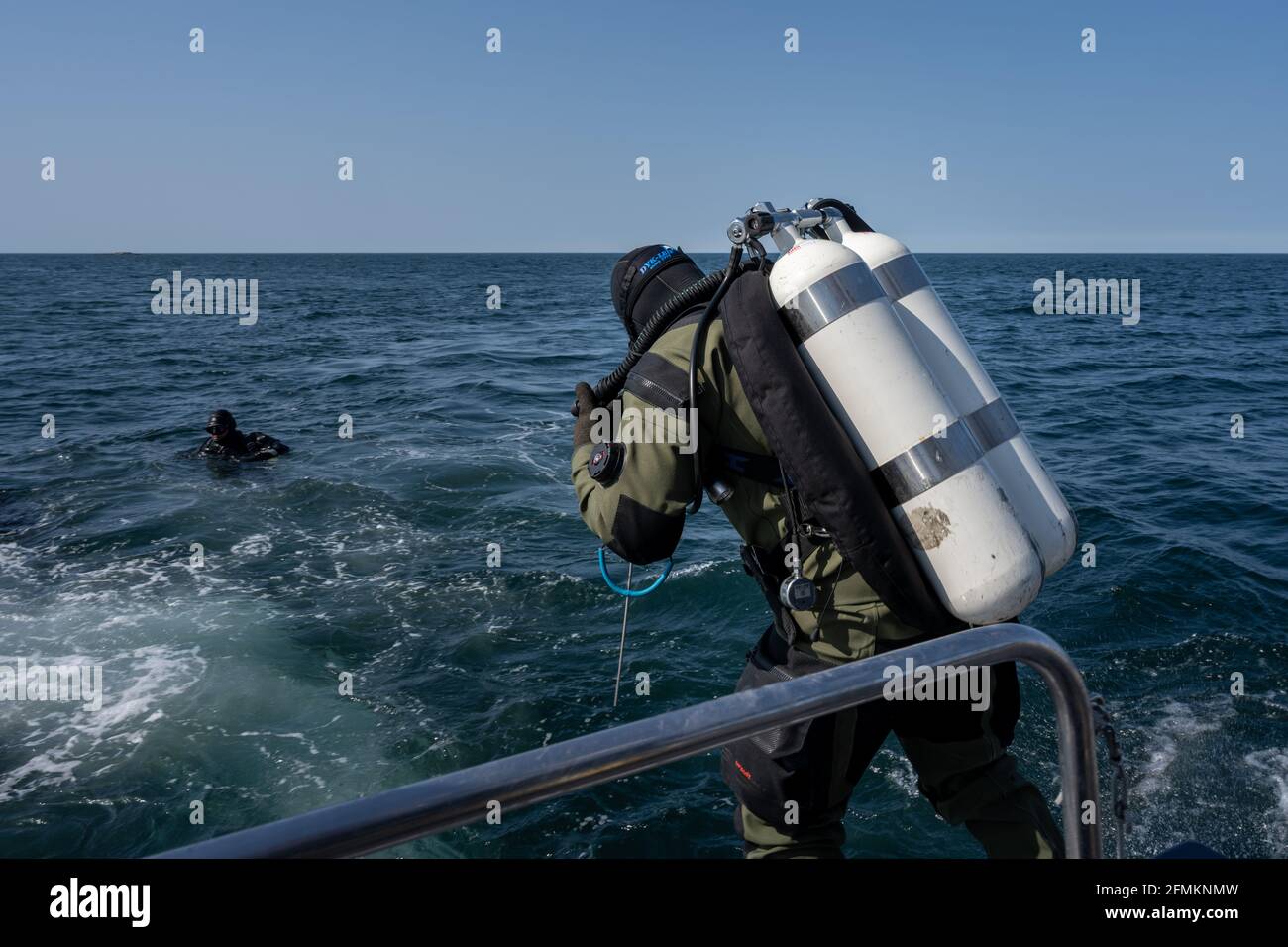 April 17, 2021 - Hamburgsund, Sweden: A scuba diver enters the water ...