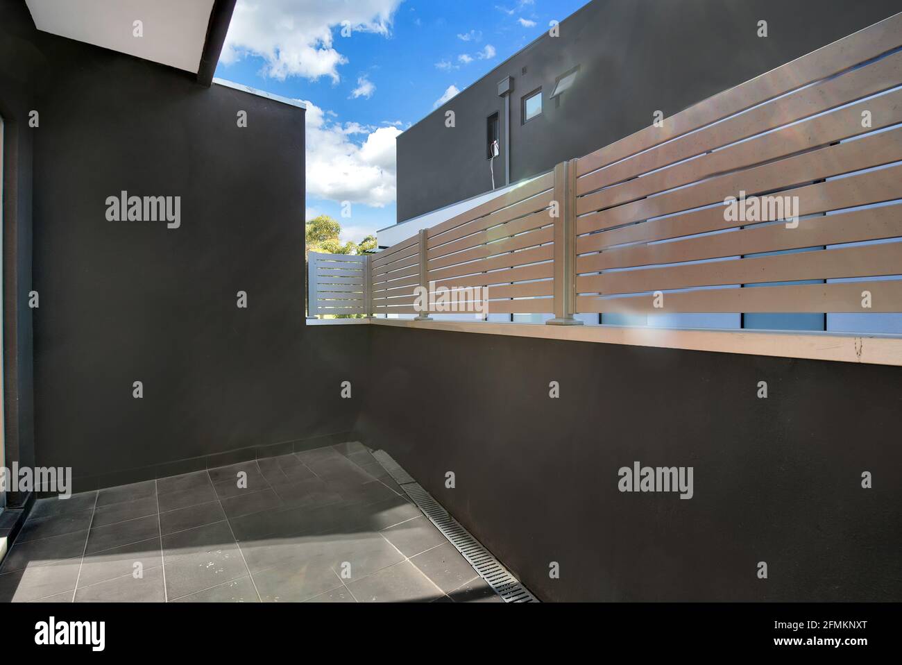 Beautiful modern balcony painted in black with metallic fences under ...