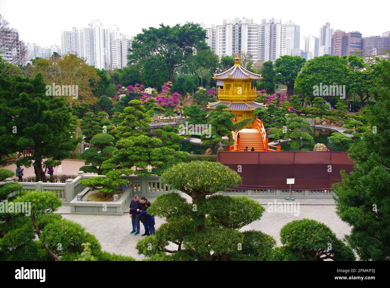 High rise buildings frame the lovely traditional Nann Linn Gardens, New ...