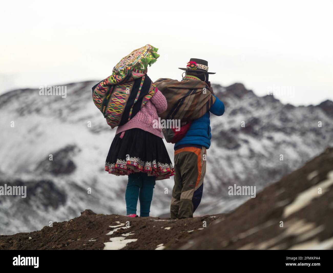 Local indigenous people in traditional colourful andean clothes at ...
