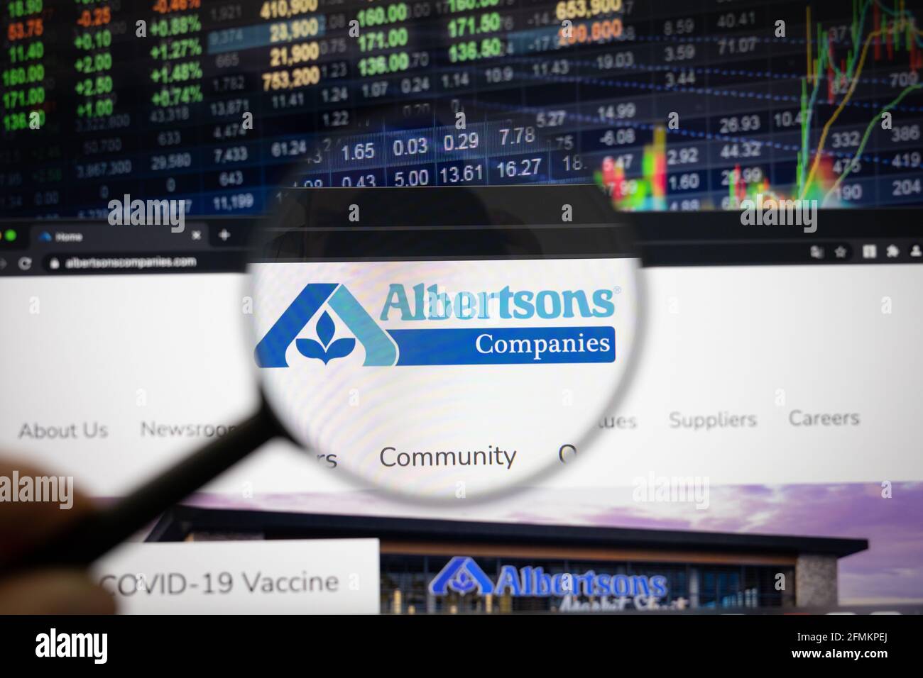 Albertsons company logo on a website with blurry stock market developments in the background ...