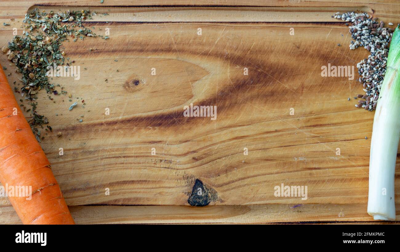 Background with copy space of a mix of spices, carrot, leek and seeds ...