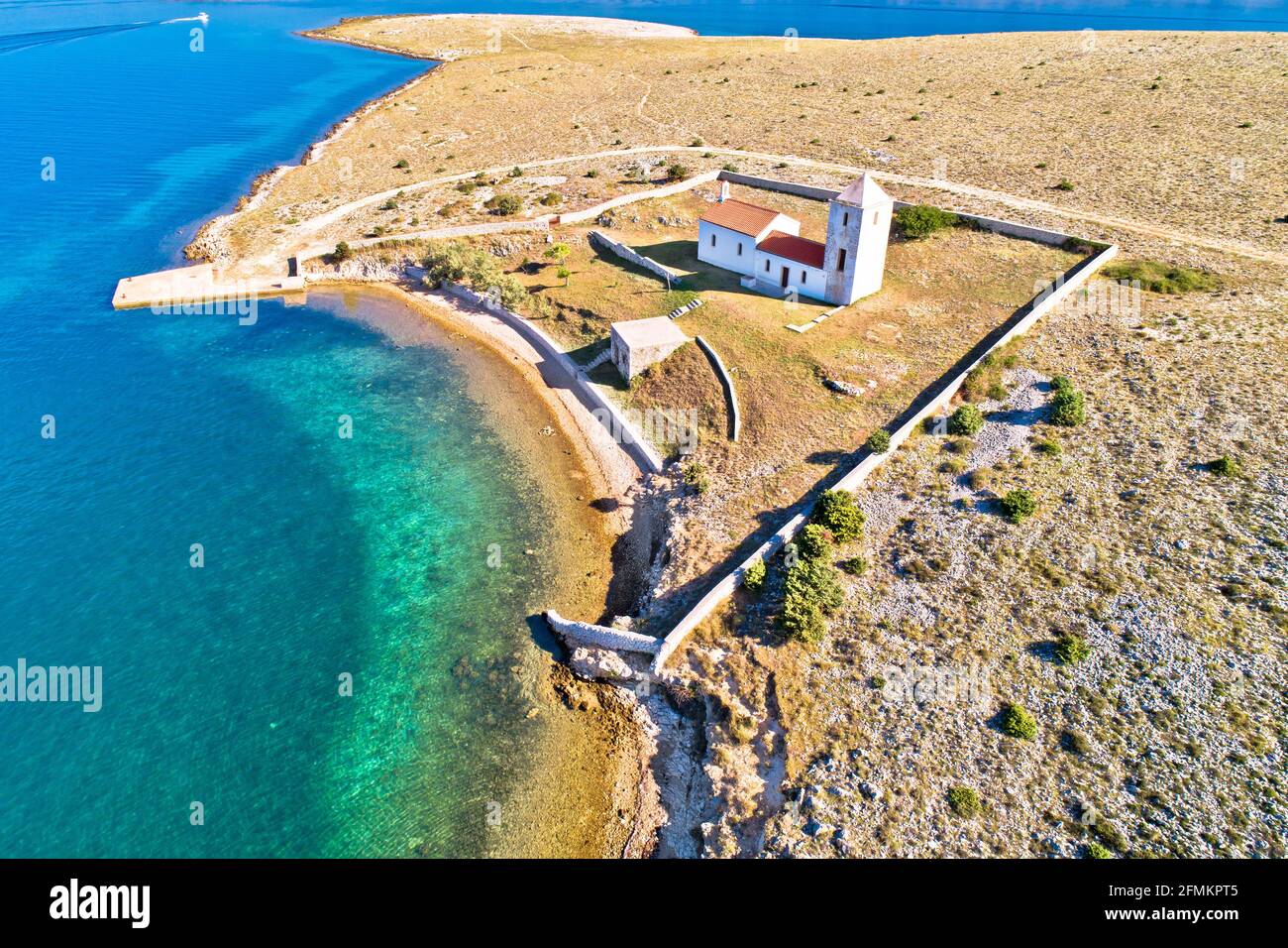 Stone desert island of Zecevo church and pilgrimage aerial view, Zadar ...
