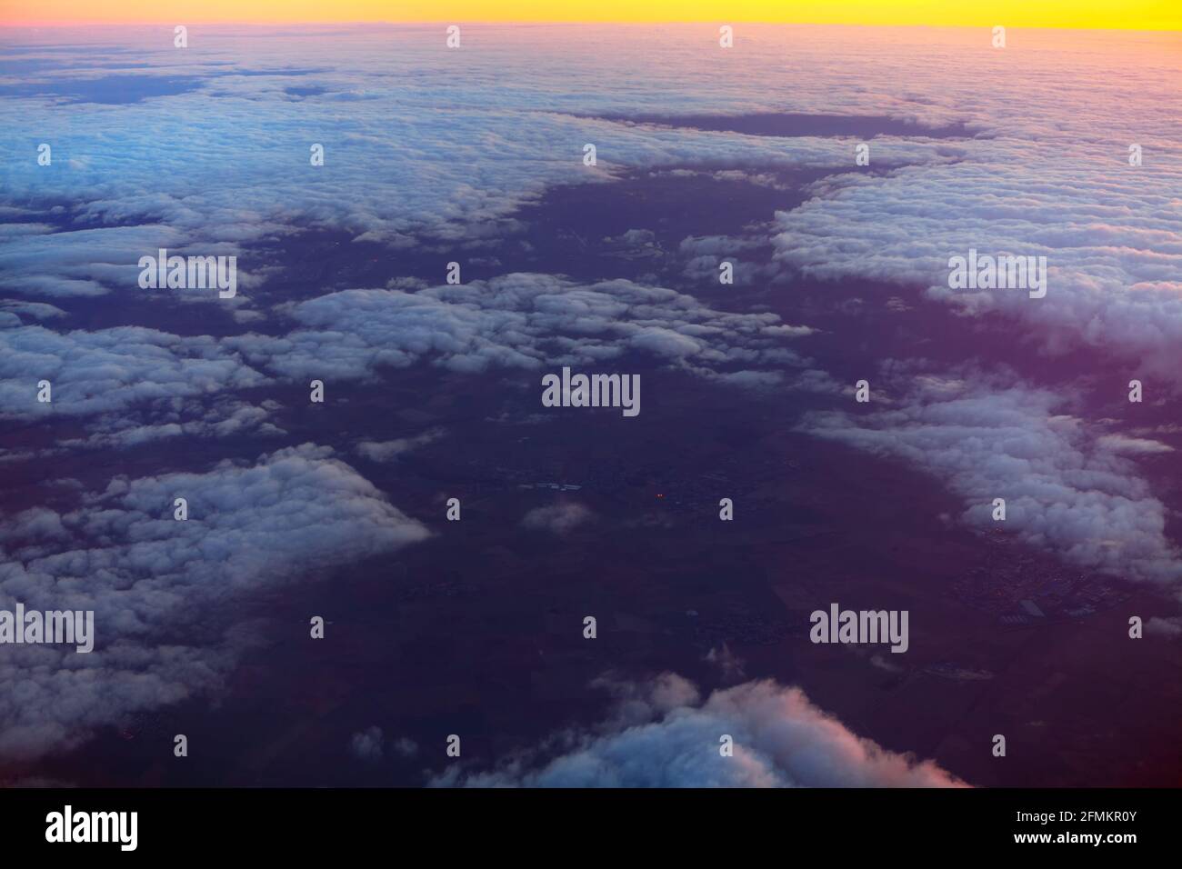 Flying through evening clouds background hi-res stock photography and ...