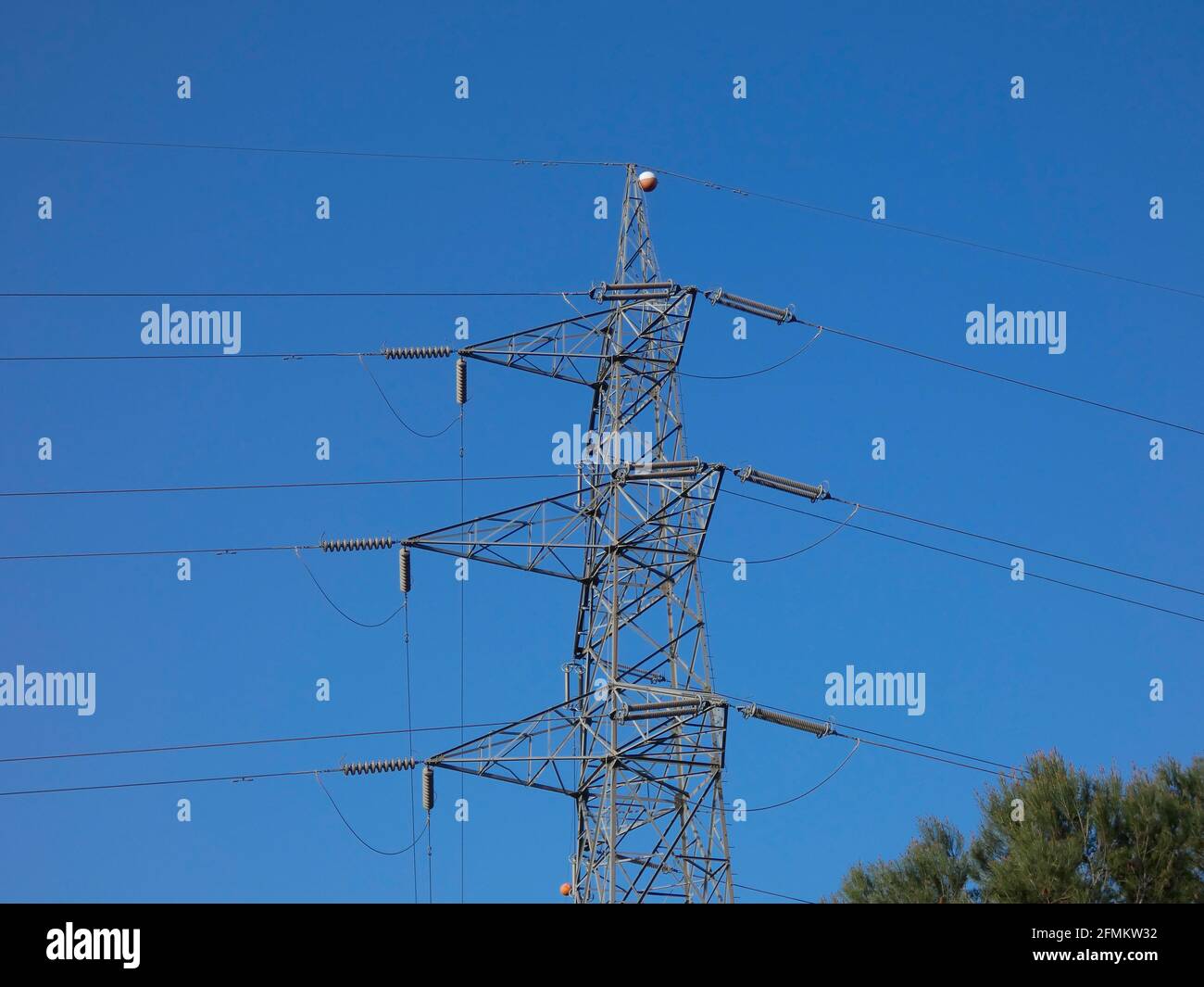 Metallic towers supporting the copper cables that carry electric power ...