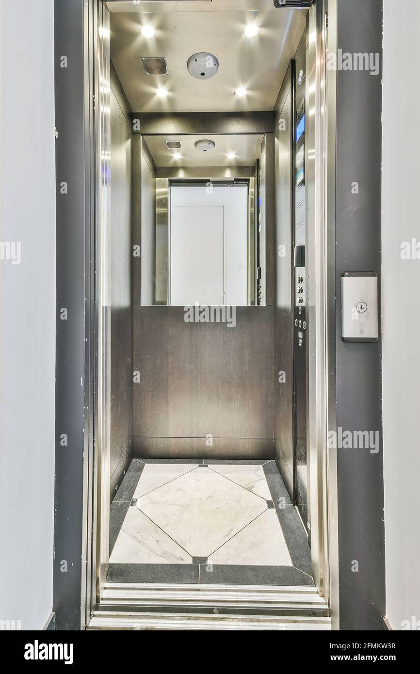 Opened doors of elevator in modern building Stock Photo - Alamy