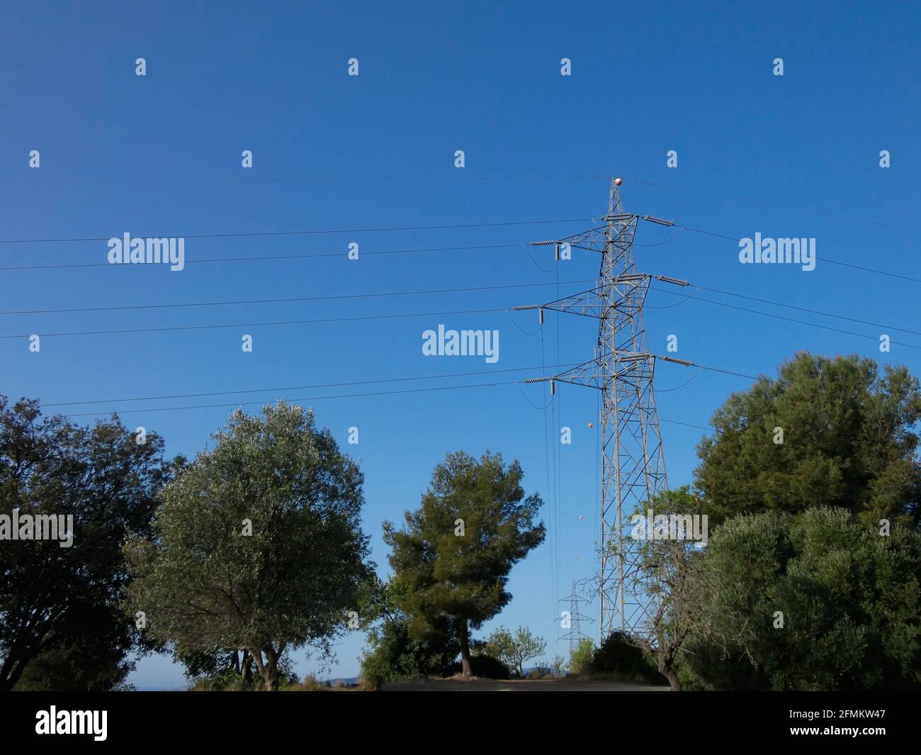 Metallic towers supporting the copper cables that carry electric power ...