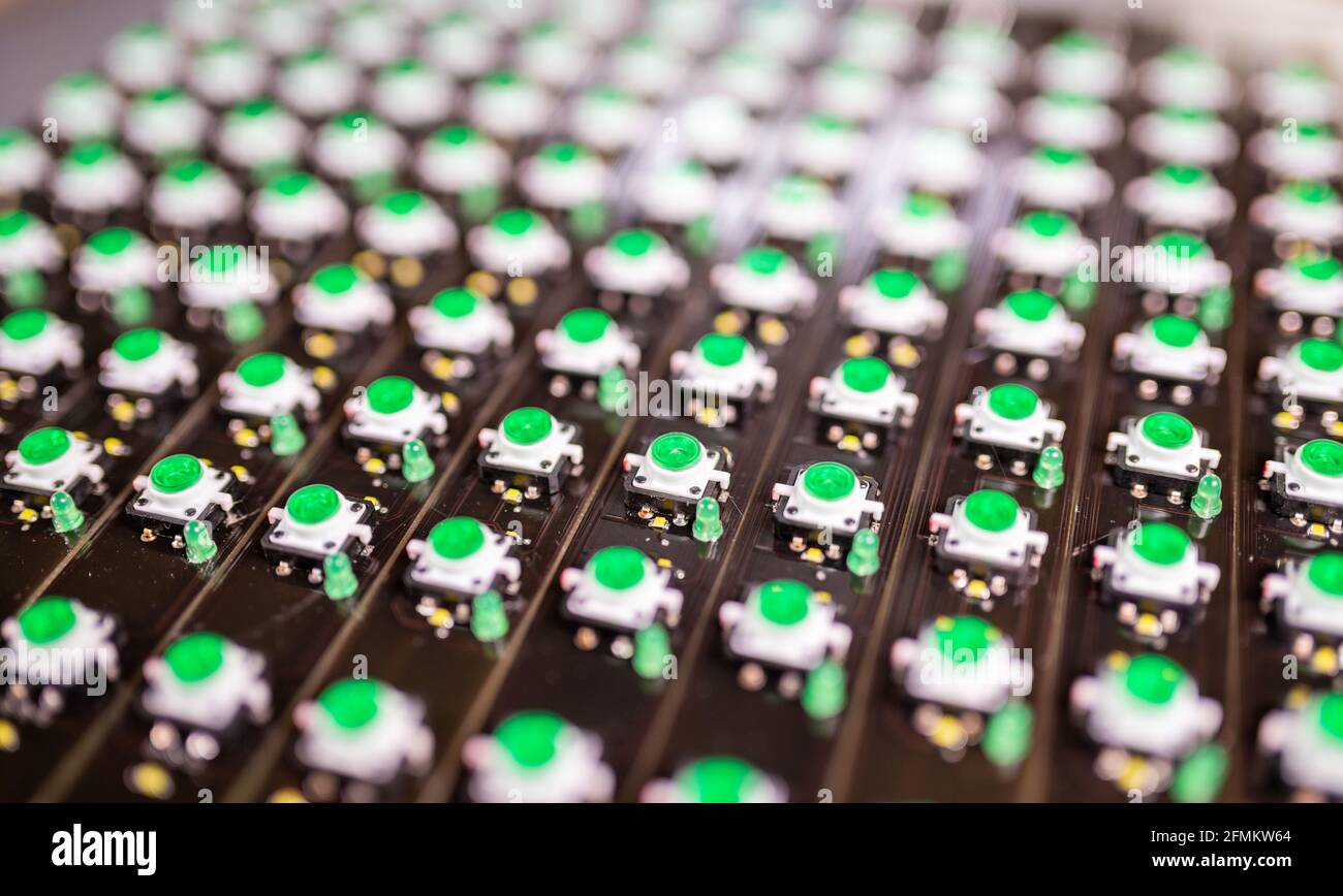 Close-up of a LED panel of green light indicators is in the production ...