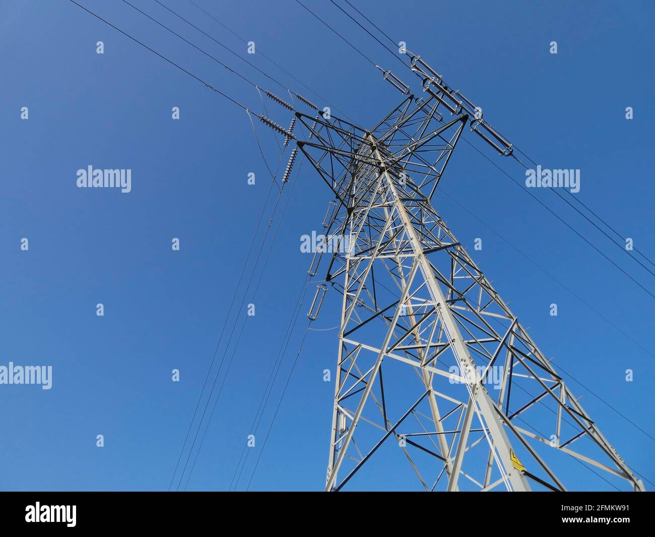 Metallic towers supporting the copper cables that carry electric power ...