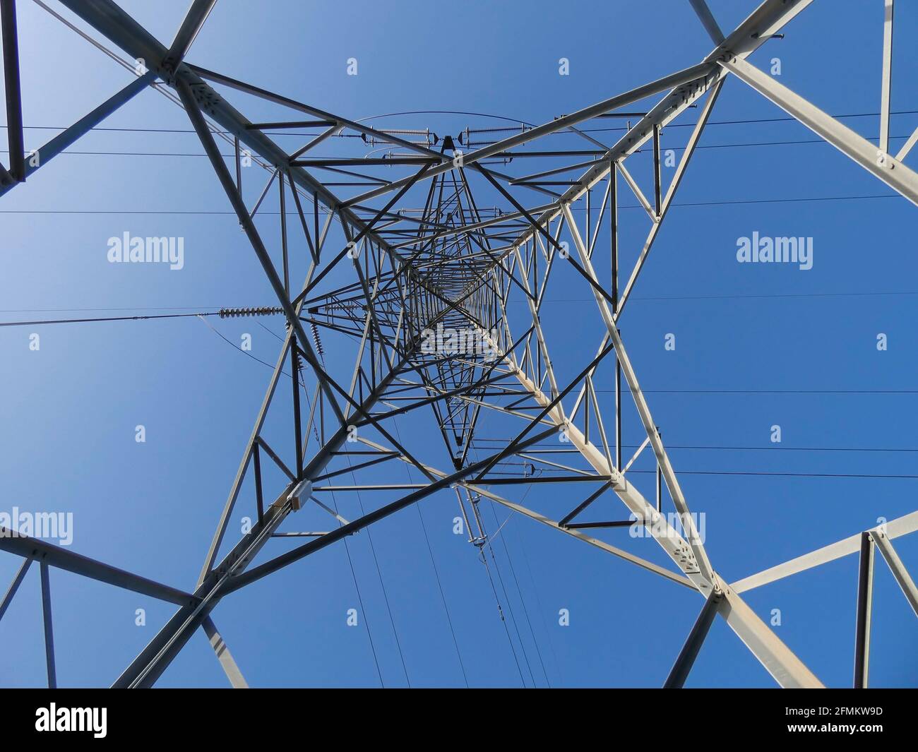 Metallic towers supporting the copper cables that carry electric power ...