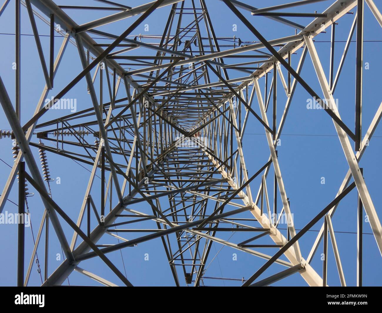 Metallic towers supporting the copper cables that carry electric power ...