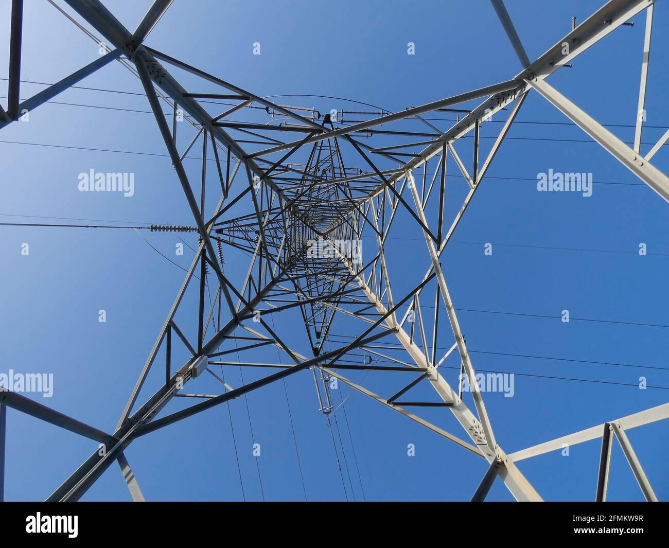 Metallic towers supporting the copper cables that carry electric power ...