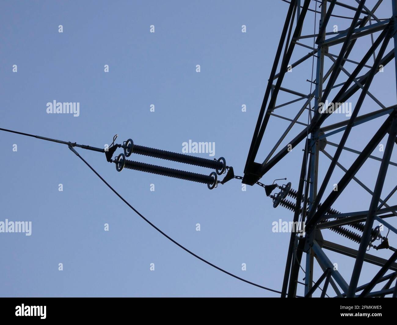 Metallic towers supporting the copper cables that carry electric power ...