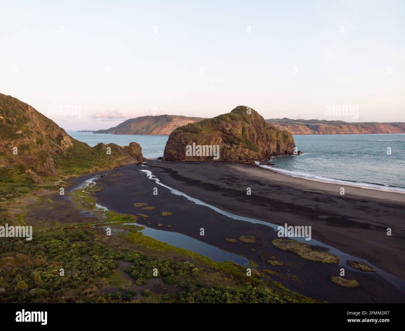 Aerial nature landscape sunset panorama of idyllic remote black sand ...