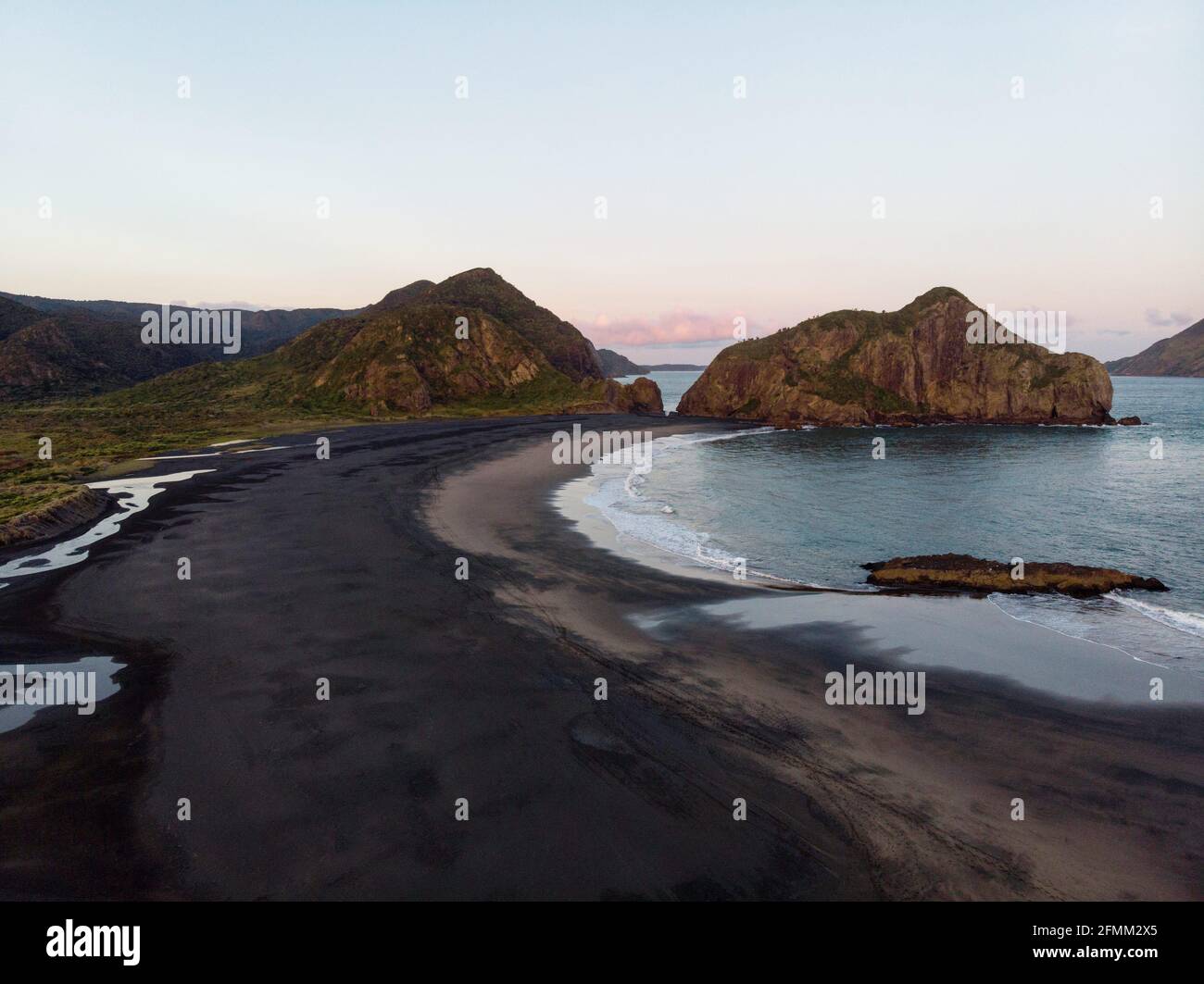 Aerial nature landscape sunset panorama of idyllic remote black sand ...