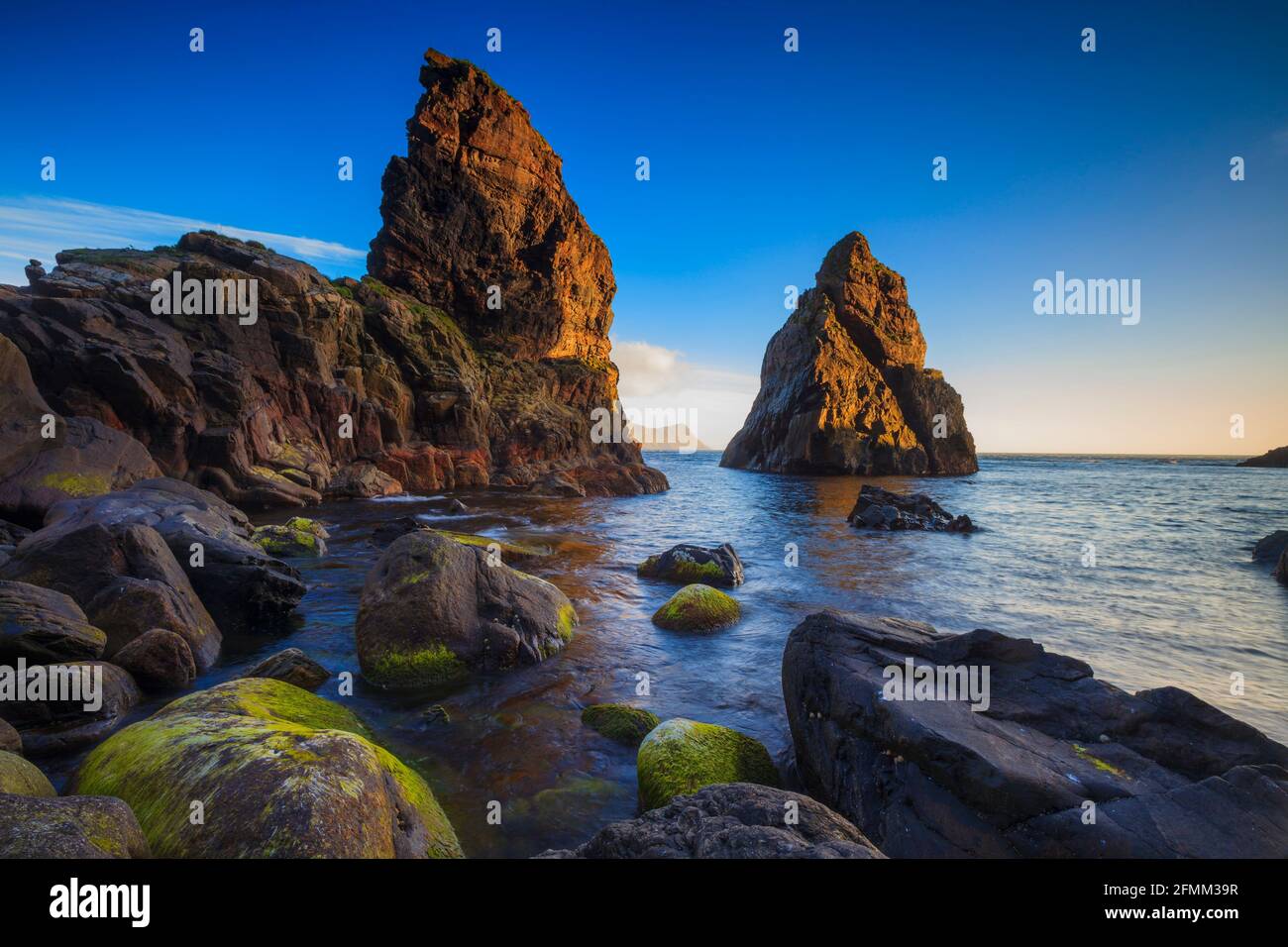 Beautiful seascape and last evening sunlight on seastacks at Runde ...