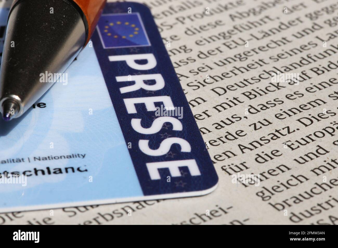 Press card, ballpoint and newspaper article as a symbol for the press ...