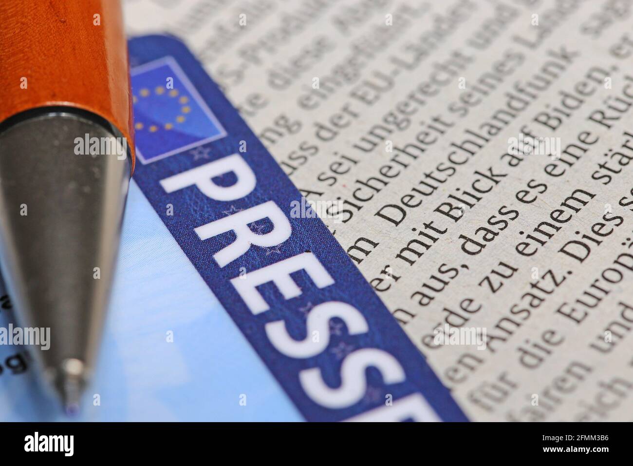 Press card, ballpoint and newspaper article as a symbol for the press ...