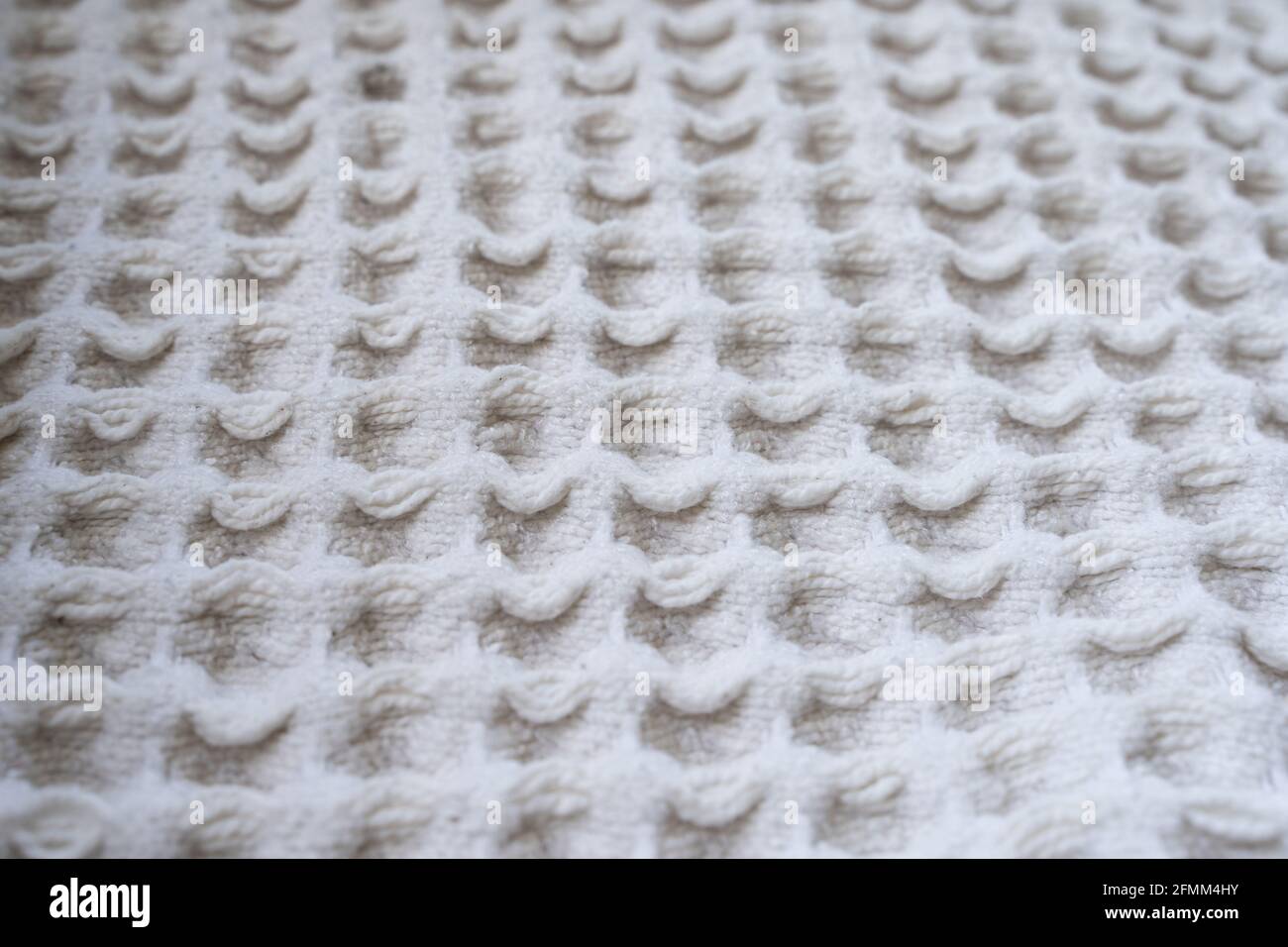 Closeup on wool white blanket with squares. Fashion textile texture ...