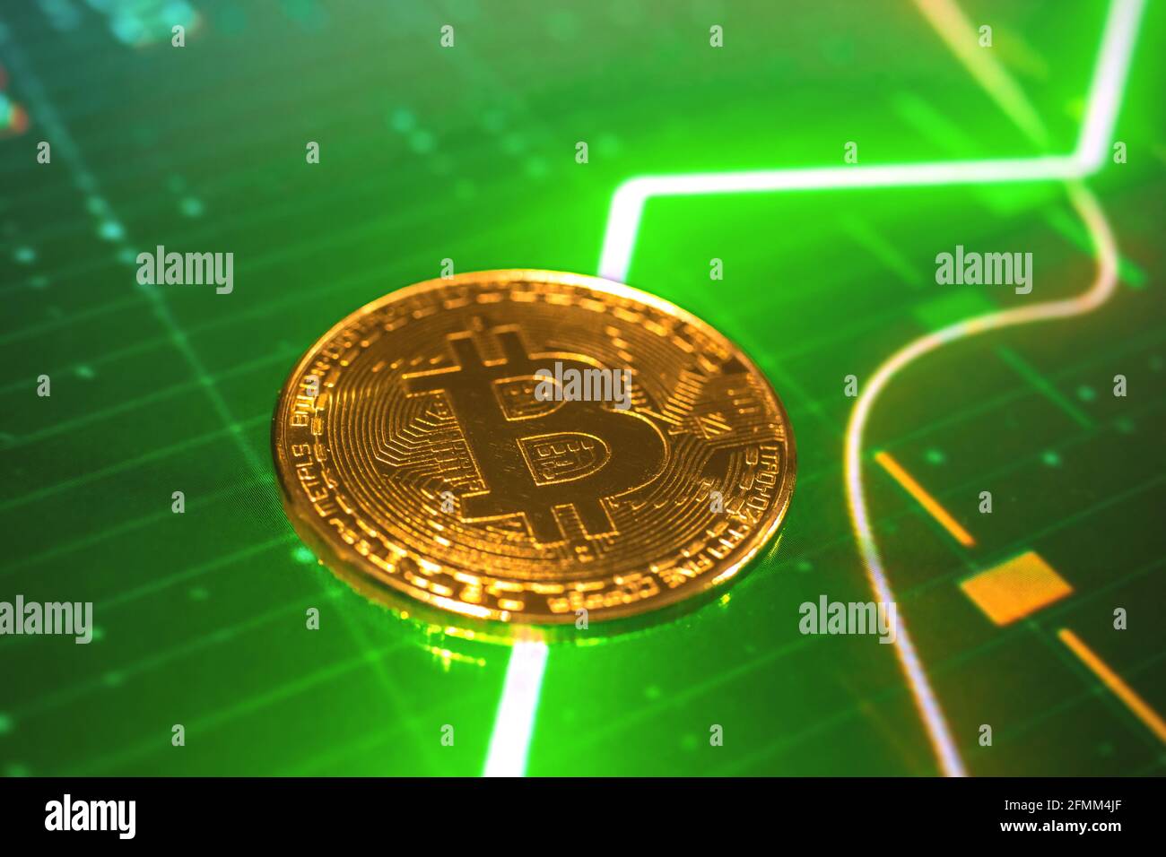 Bitcoin coin on the green growth stock chart graphs, concept photo ...