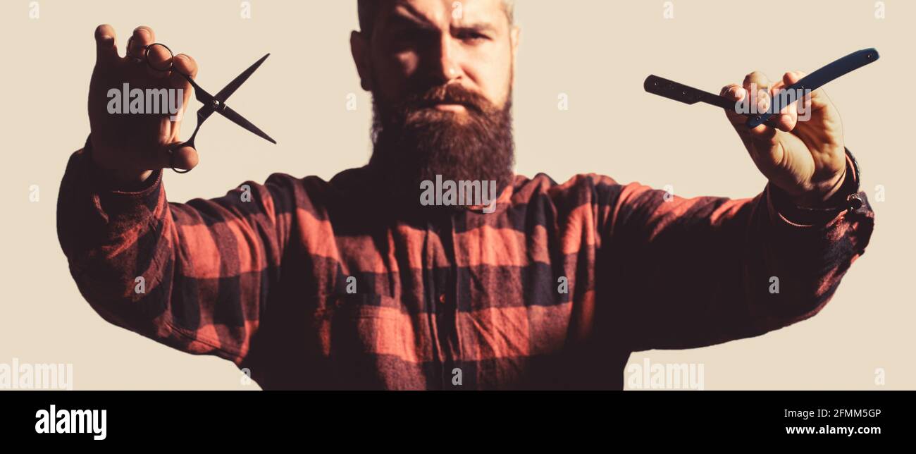 Barber scissors and straight razor, barber shop. Male in barbershop ...