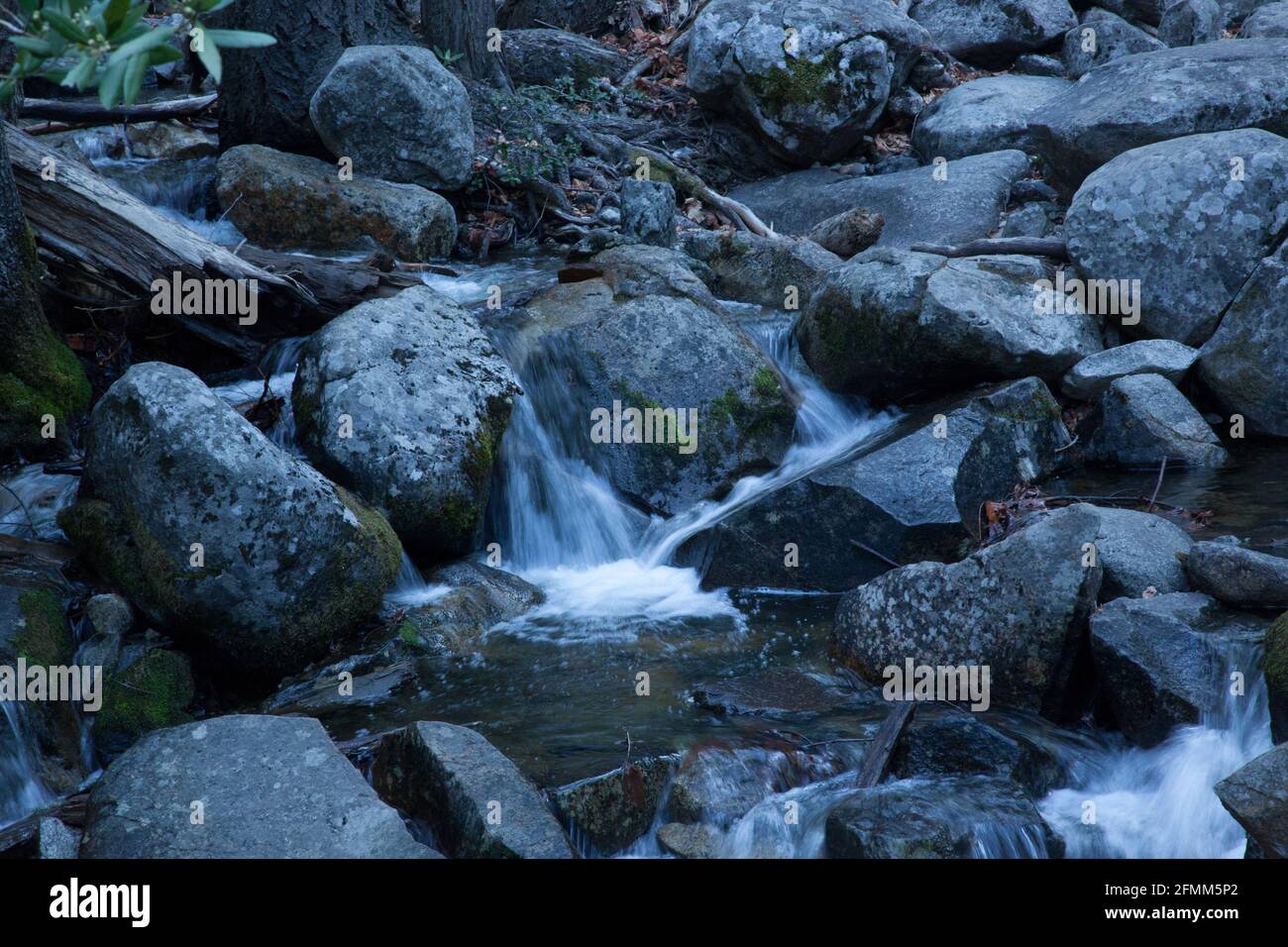 Stream cascading over rocks and stones Stock Photo - Alamy