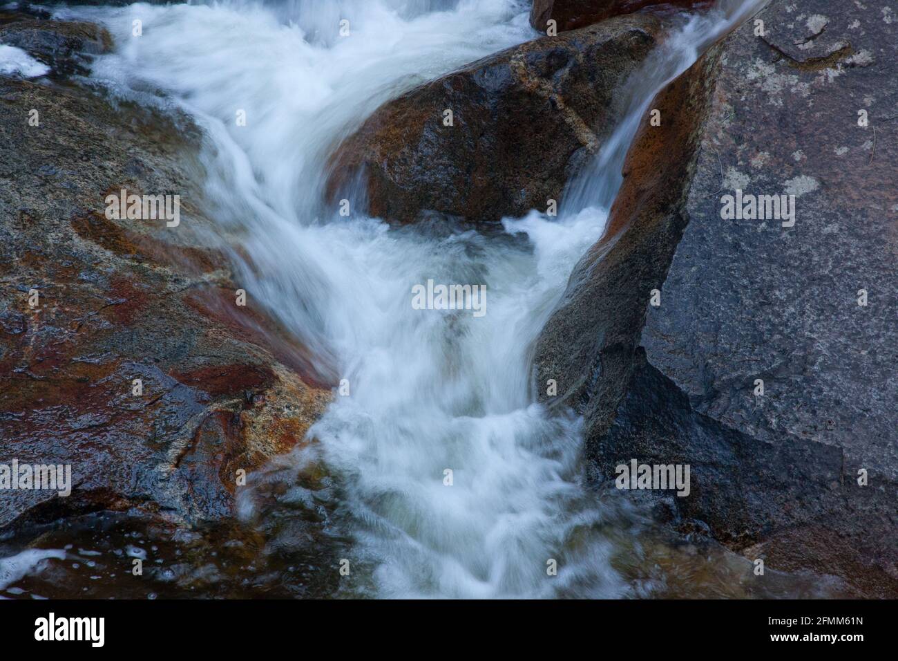 Stream cascading over rocks and stones Stock Photo - Alamy
