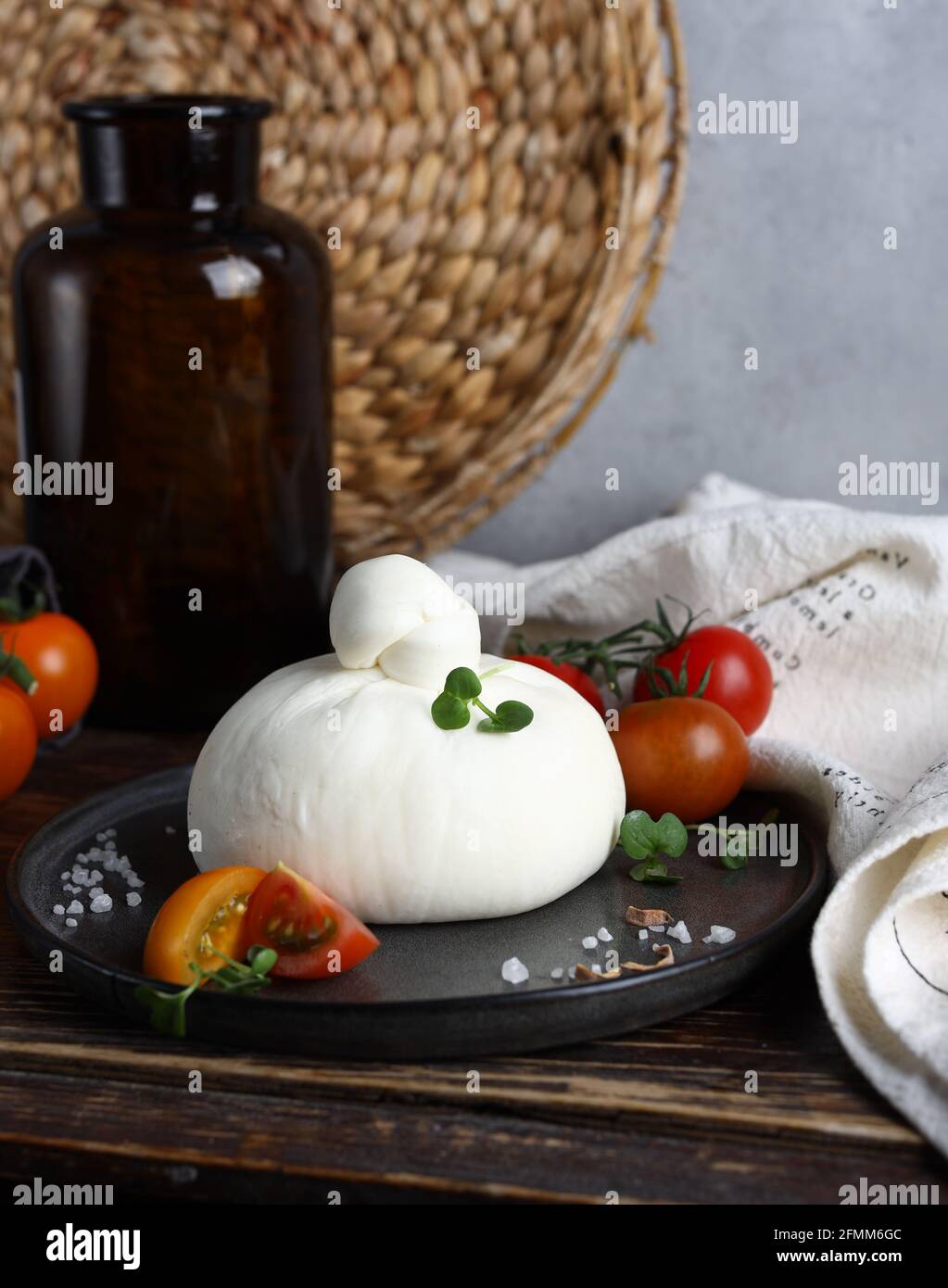 homemade soft burrata cheese with tomatoes Stock Photo - Alamy